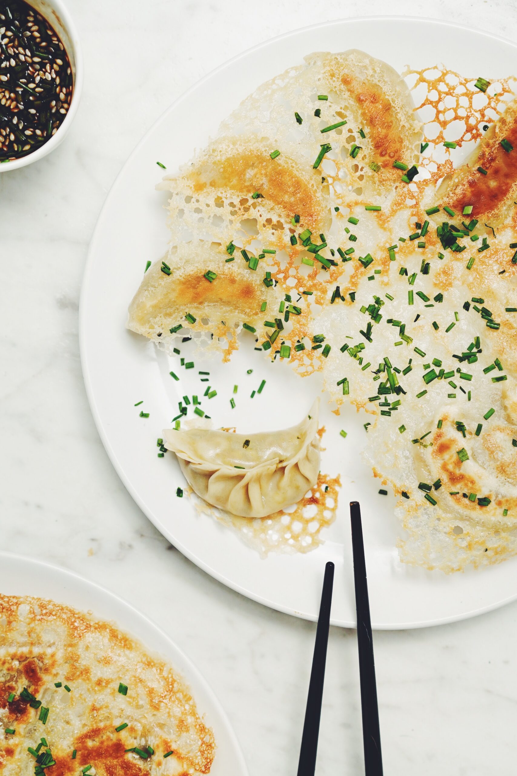 vegan chinese potstickers with a lacy skirt - hot for food